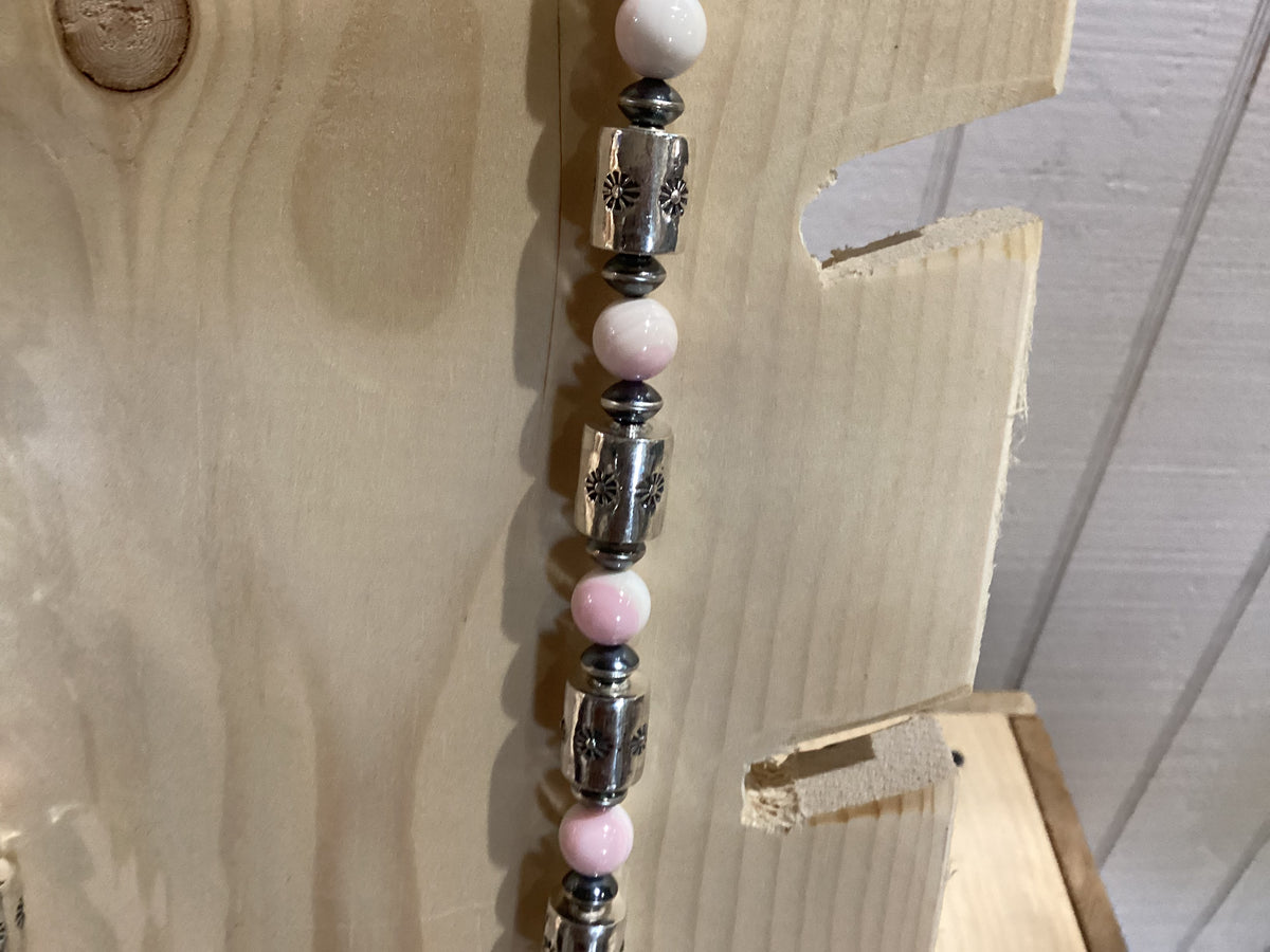 Pink Conch Shell and Stamped Sterling Drums – Ben Johnson Cowboy Museum